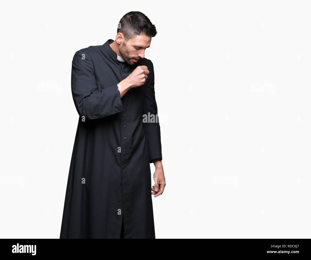 Young Christian priest over isolated background feeling unwell and ...