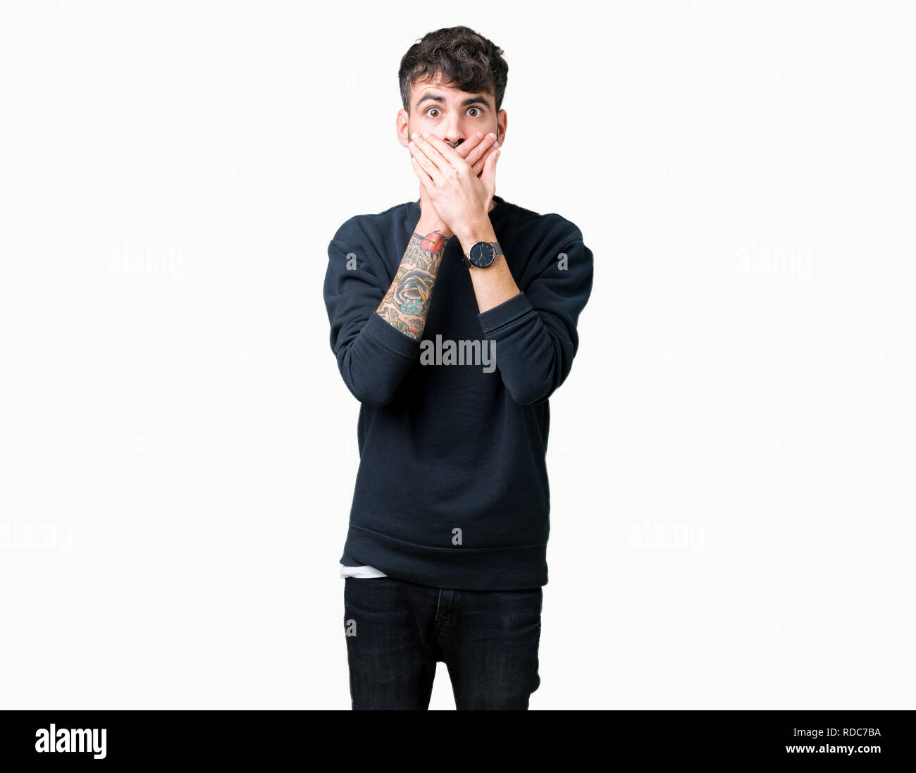 Young handsome man over isolated background shocked covering mouth with ...