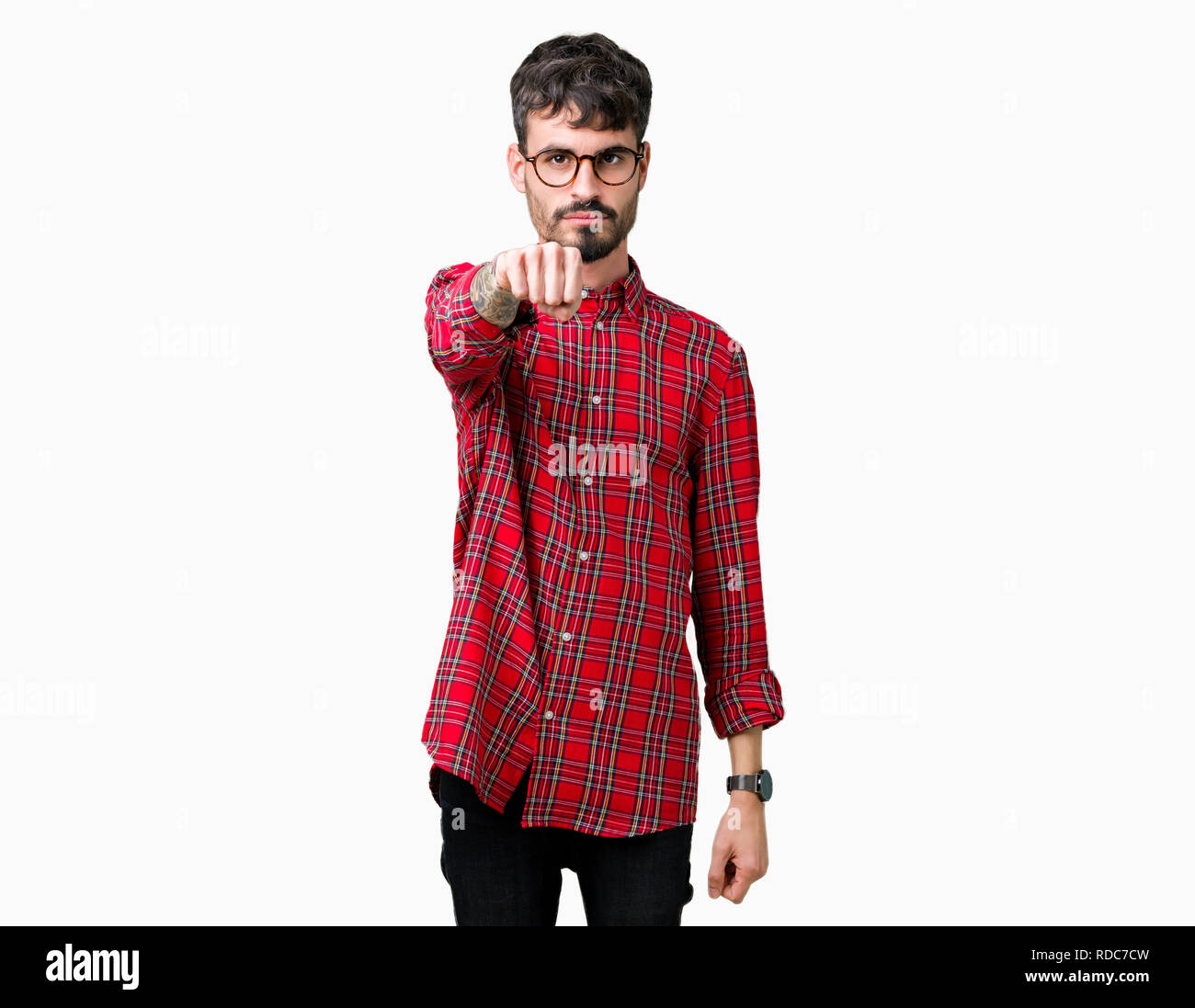 Young handsome man wearing glasses over isolated background Punching ...