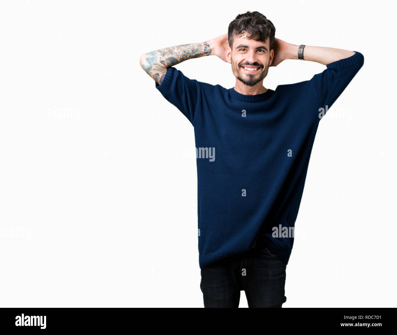 Young handsome man over isolated background Relaxing and stretching ...