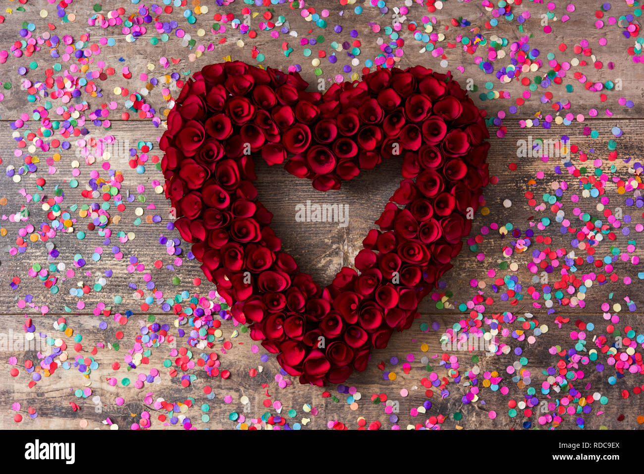 Red rose with confetti hi-res stock photography and images - Alamy