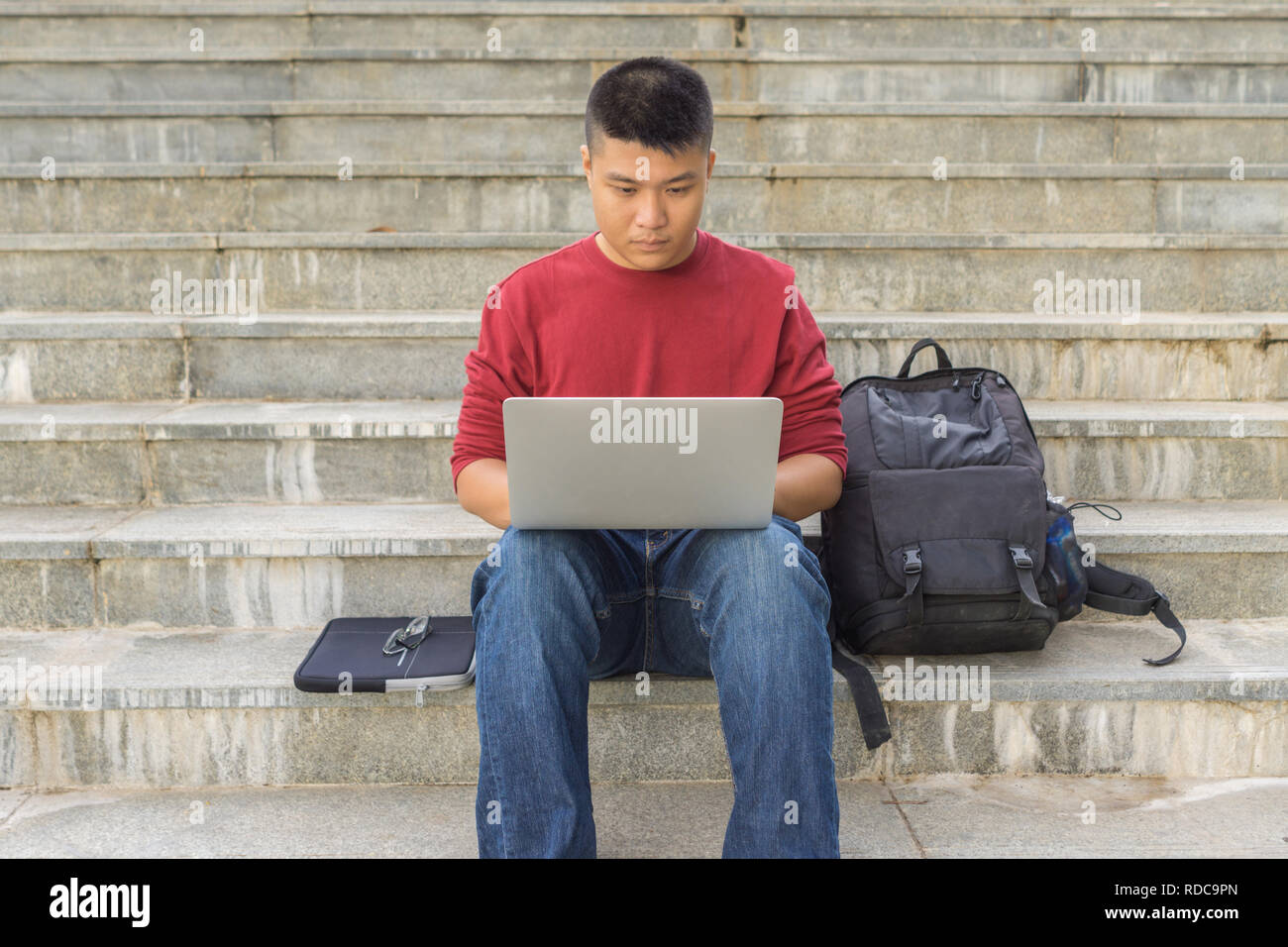 Teenager laptop sitting on stairs hi-res stock photography and images ...