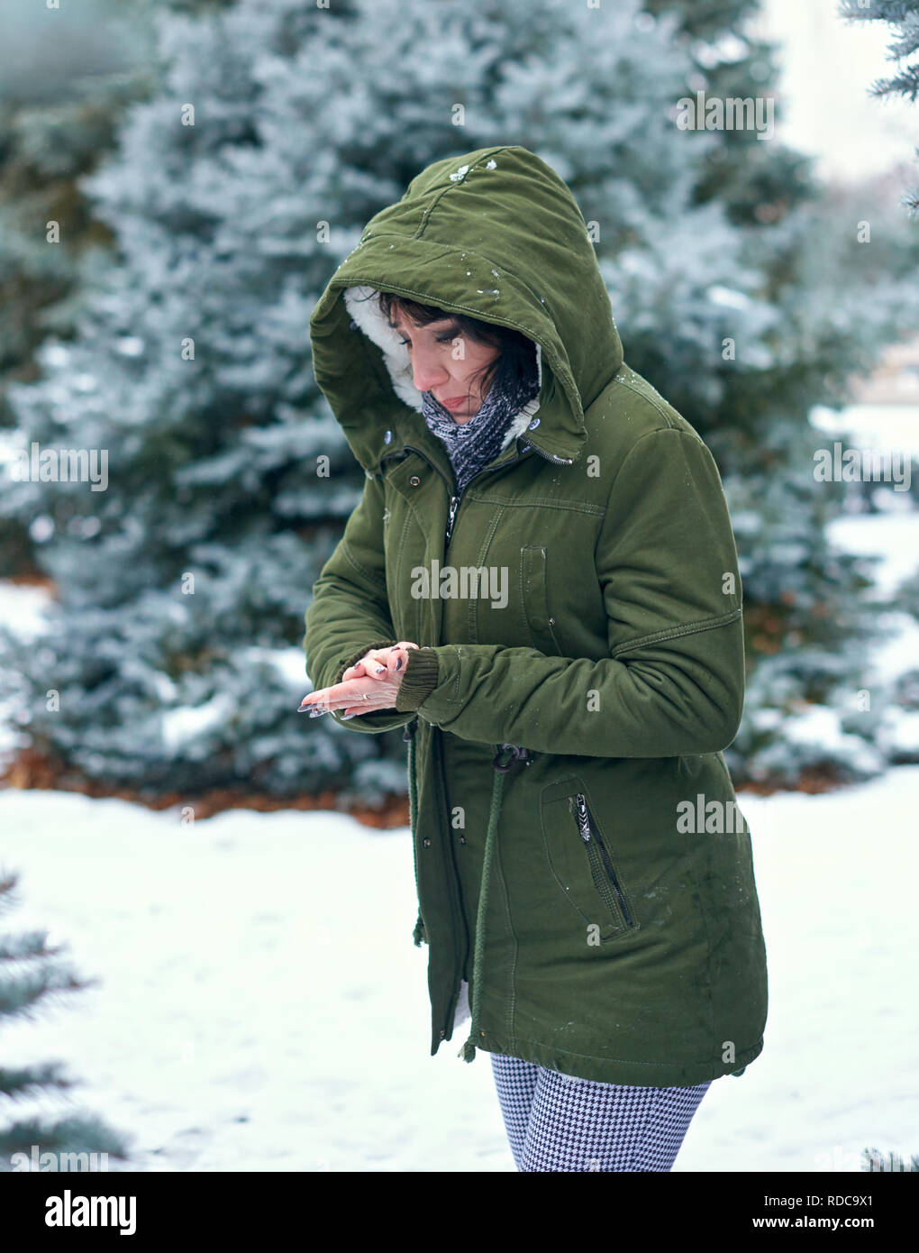 Sad woman is posing in winter forest, snowy fir trees Stock Photo - Alamy