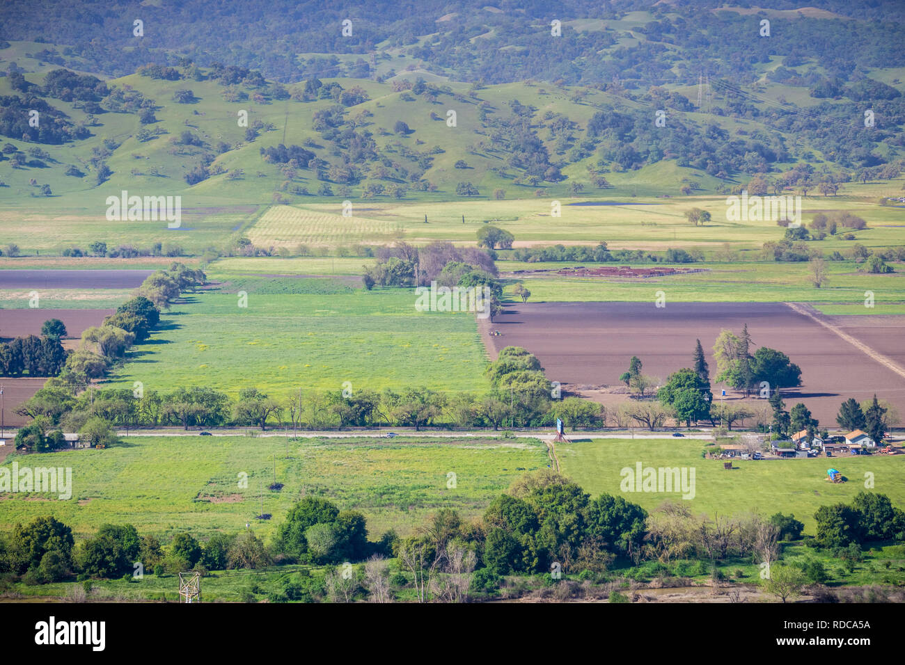 Aerial view of agricultural fields, mountain background, south San ...