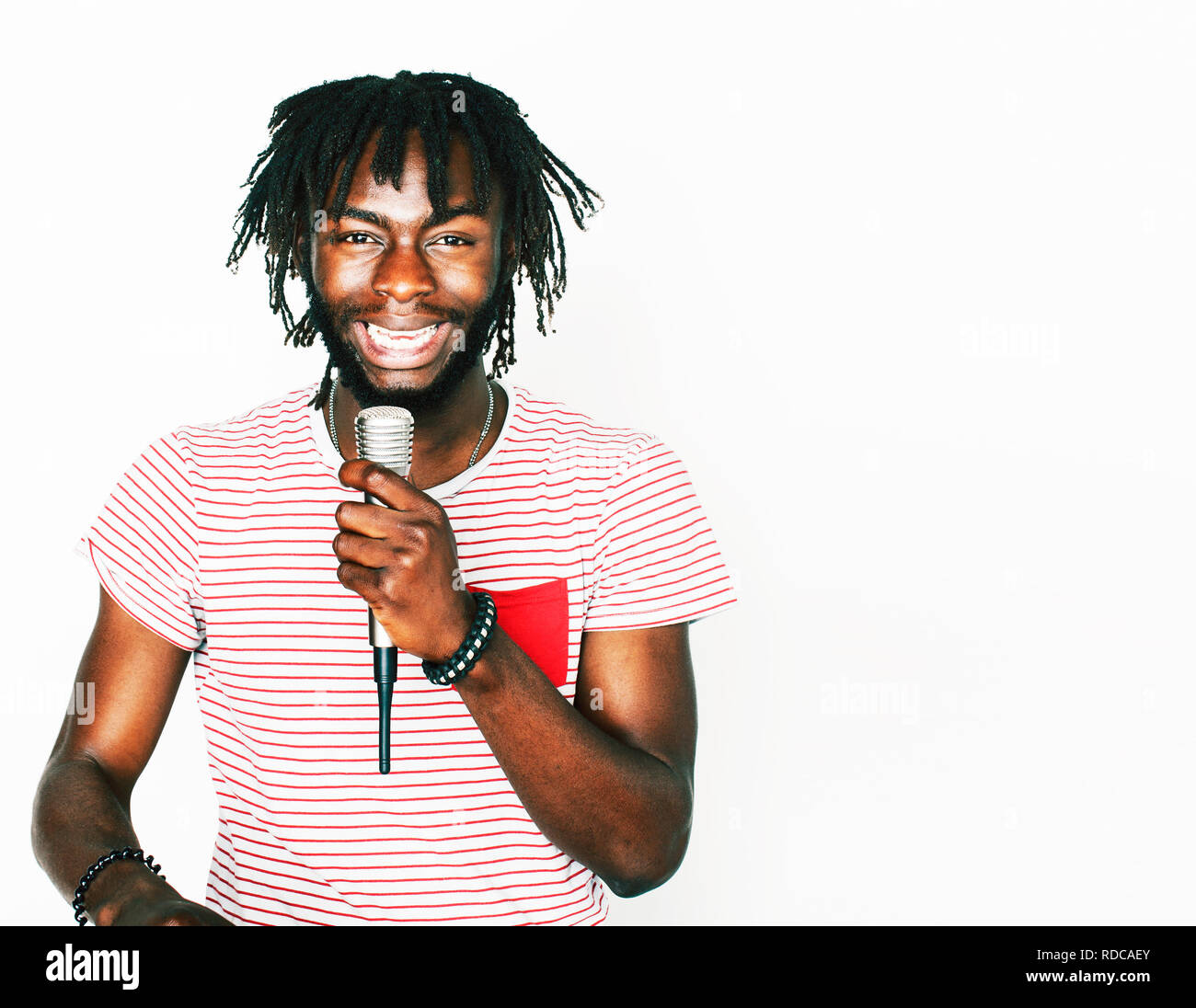 young handsome african american boy singing emotional with micro Stock ...