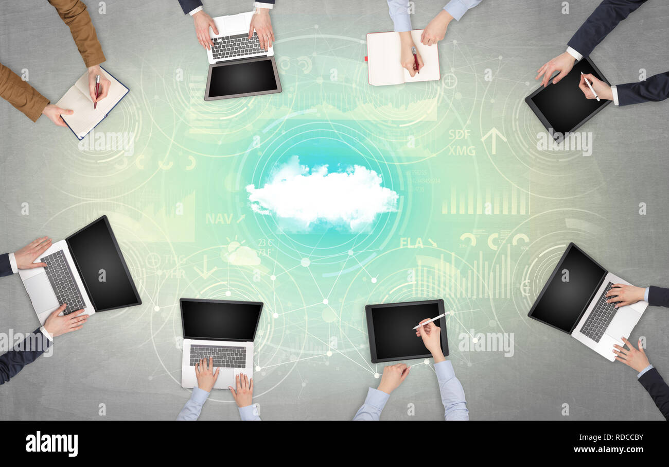 Group of people with devices in hands working on reports with online ...