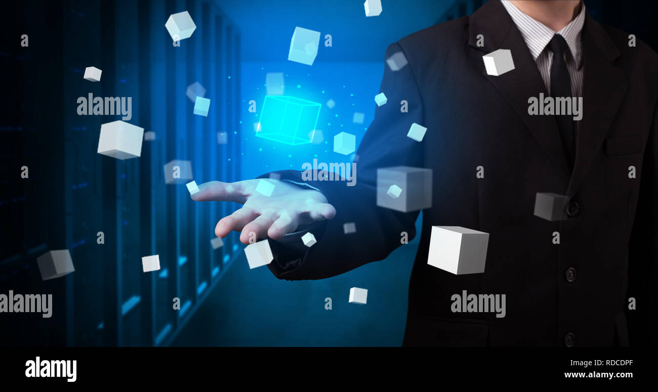 Person holding hologram projection displaying white cubes in server ...