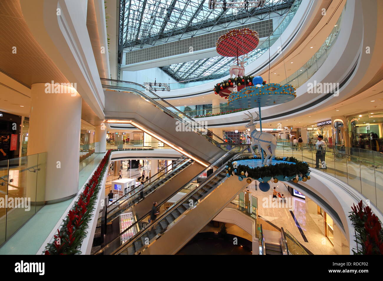 People visit Raffles City Shopping mall in Singapore Stock Photo - Alamy