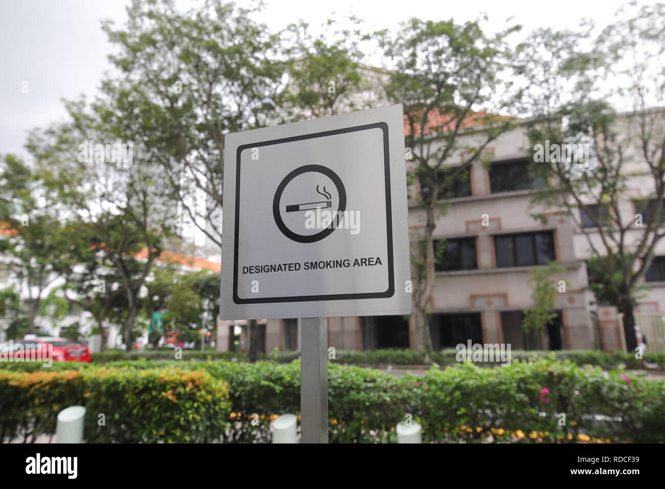 Designated smoking area sign in Singapore Stock Photo - Alamy
