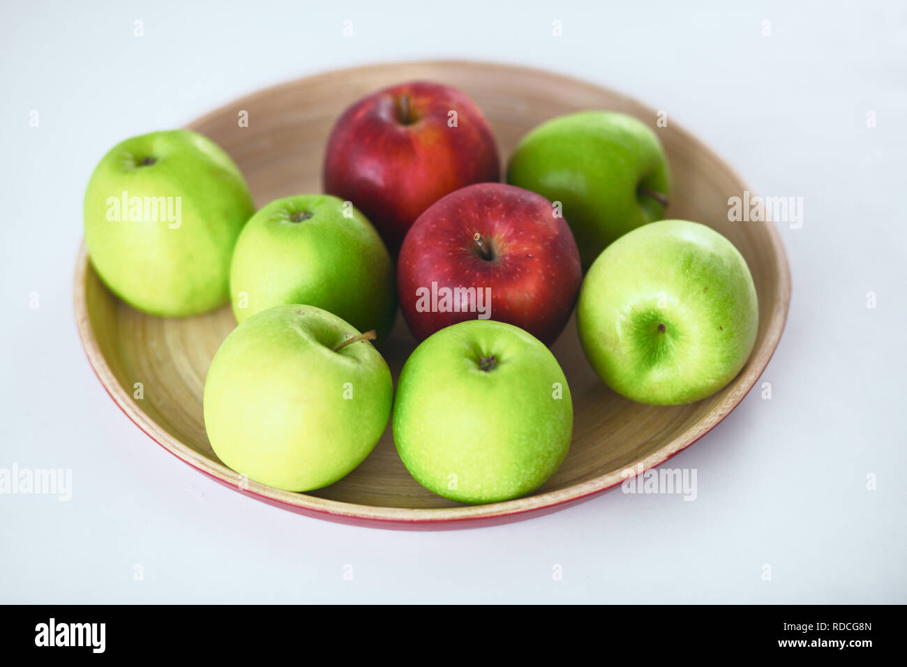 wooden plate with ripe fresh red and green apples Stock Photo - Alamy