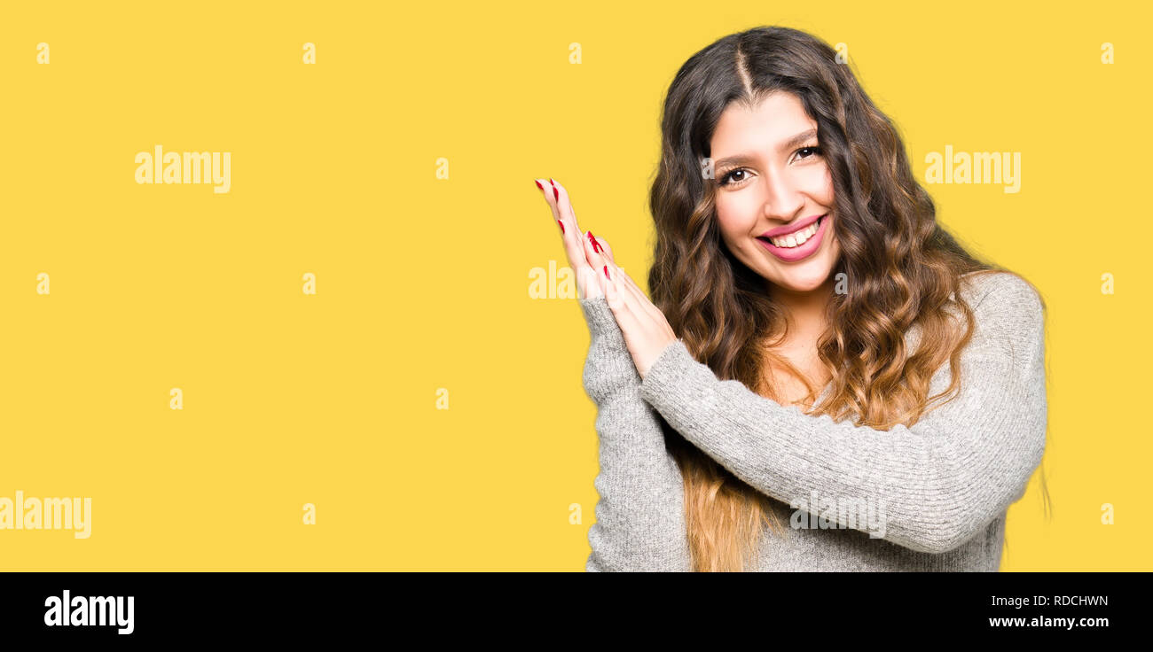 Attractive young woman clapping hands hi-res stock photography and ...
