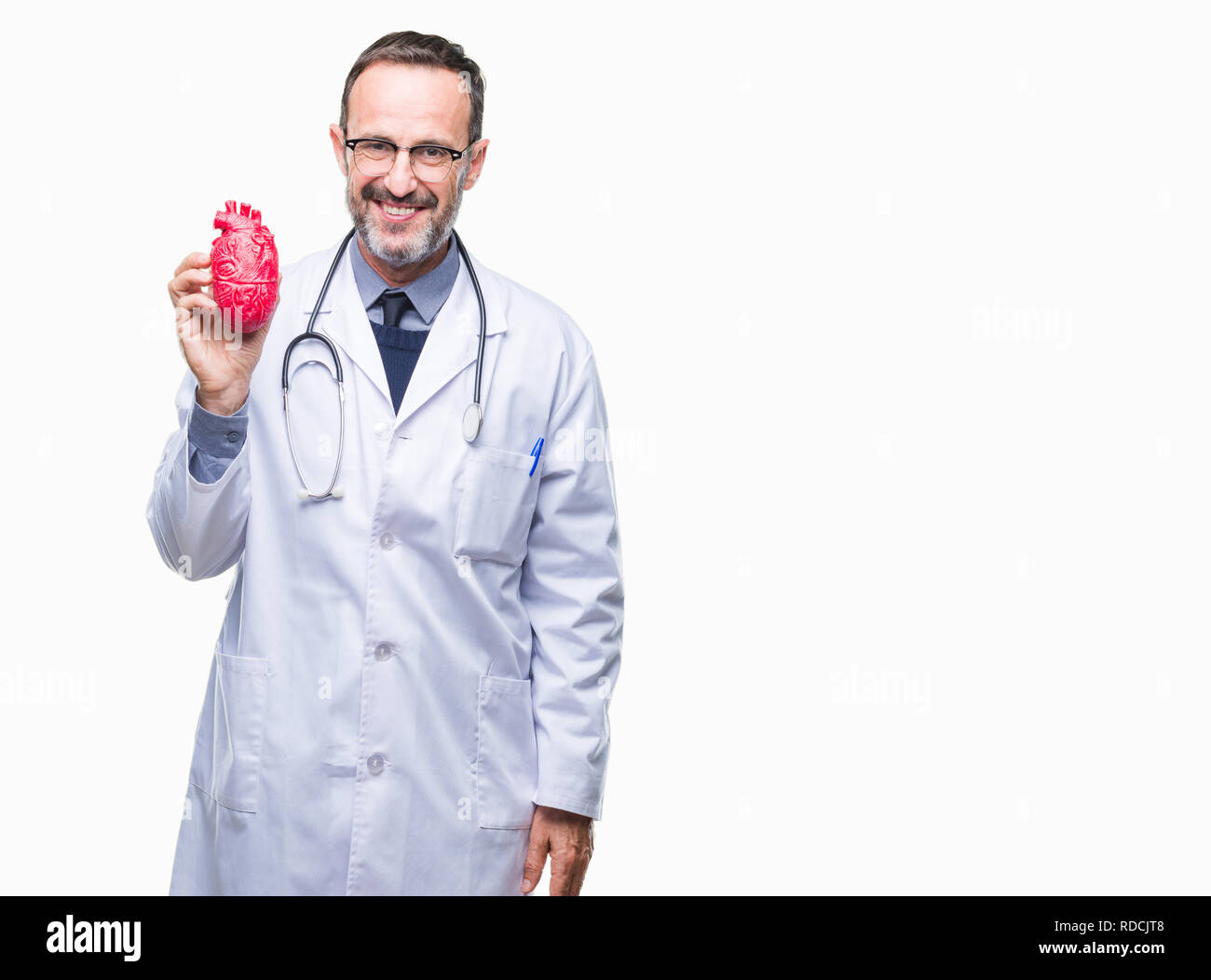 Middle age senior hoary cardiologist doctor man holding heart over ...