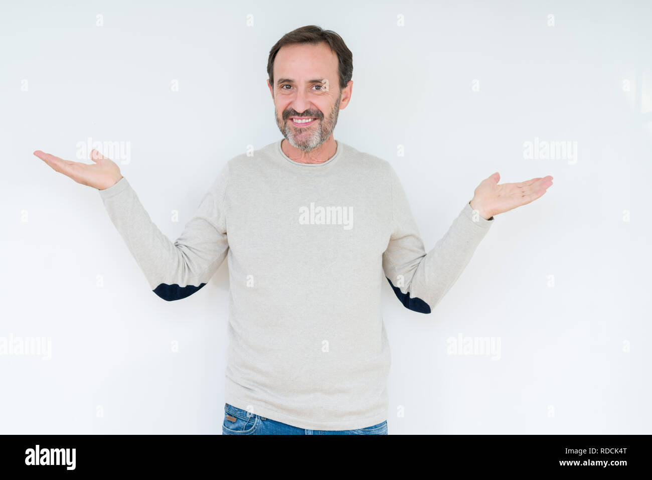 Elegant senior man over isolated background Smiling showing both hands ...