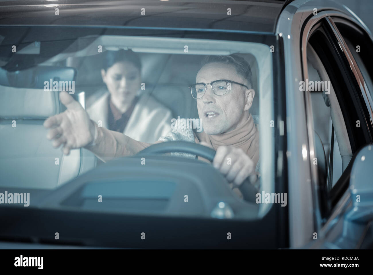 Husband and wife driving hi-res stock photography and images - Alamy