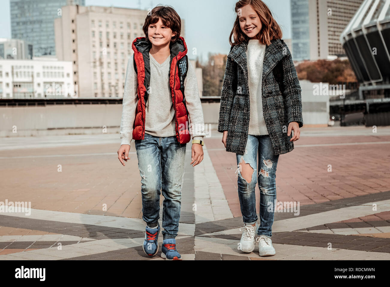 Classmates going home together after school lessons Stock Photo - Alamy