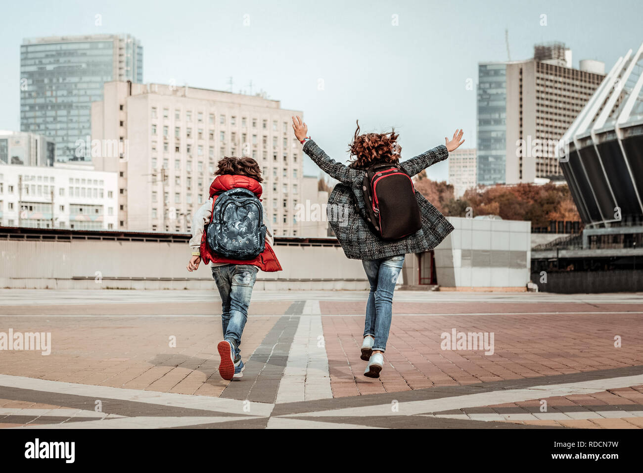 Kid jumping happily hi-res stock photography and images - Alamy
