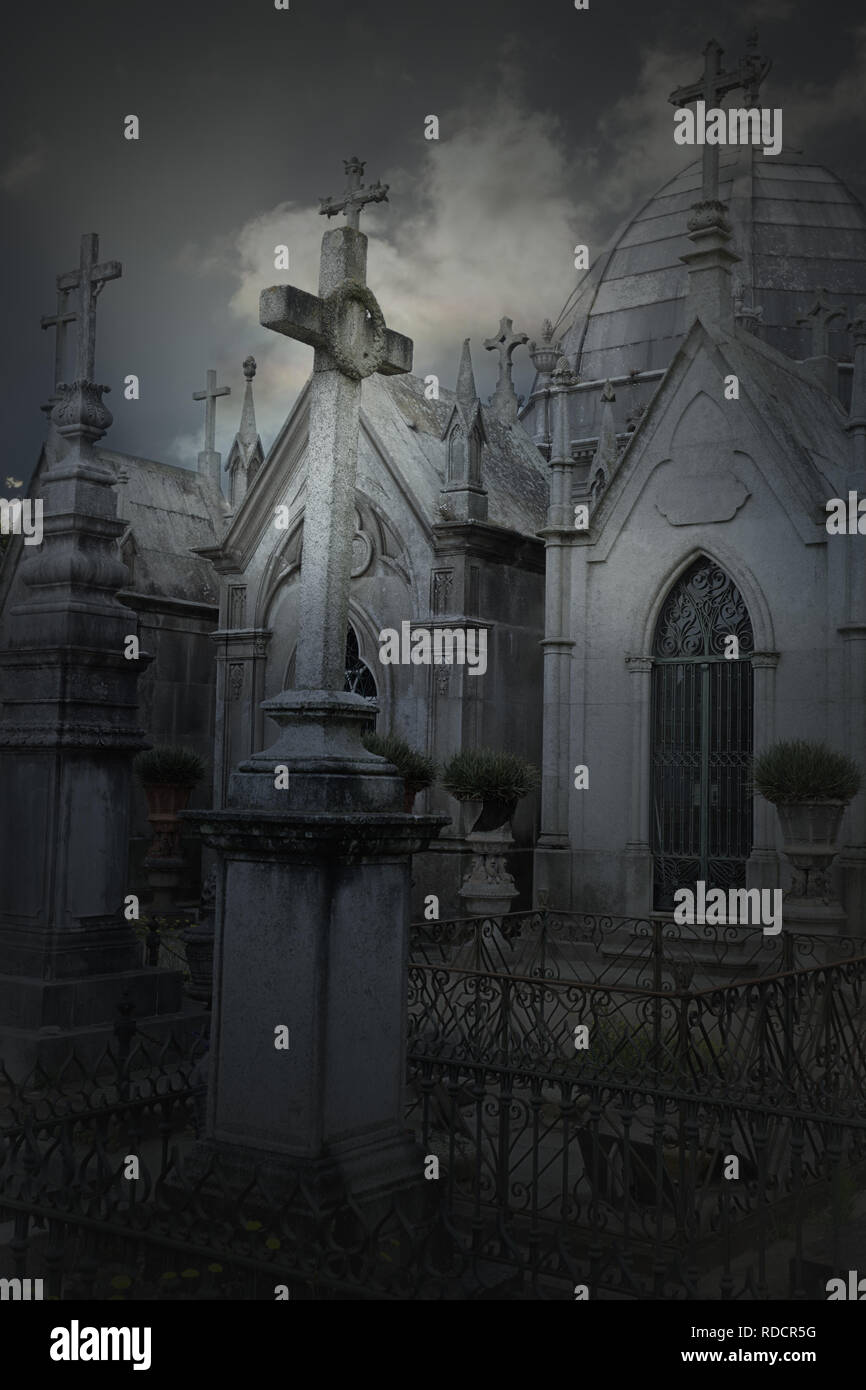 Old dramatic cemetery in a cloudy evening Stock Photo - Alamy