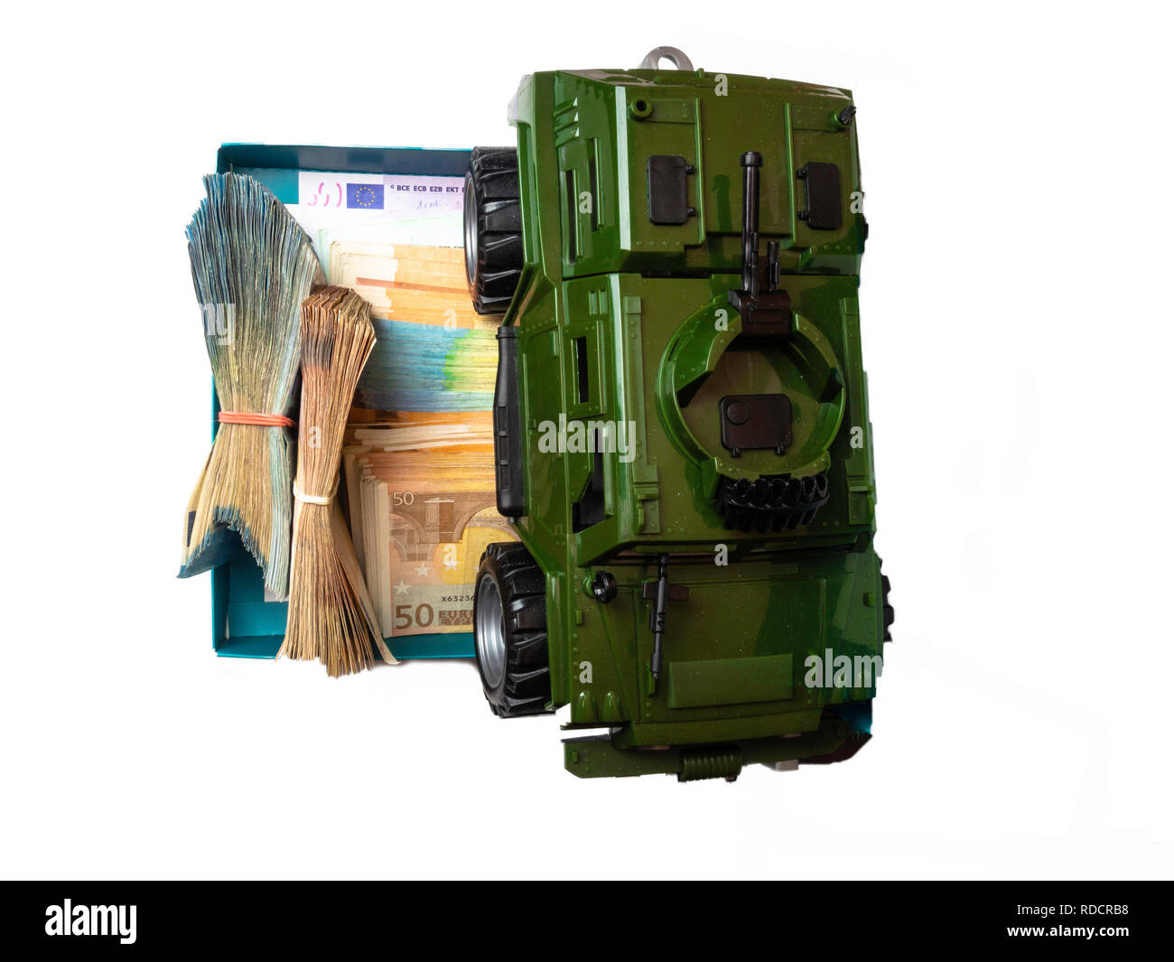 tank toy placed on euro banknotes pile. business, economy war. new ...