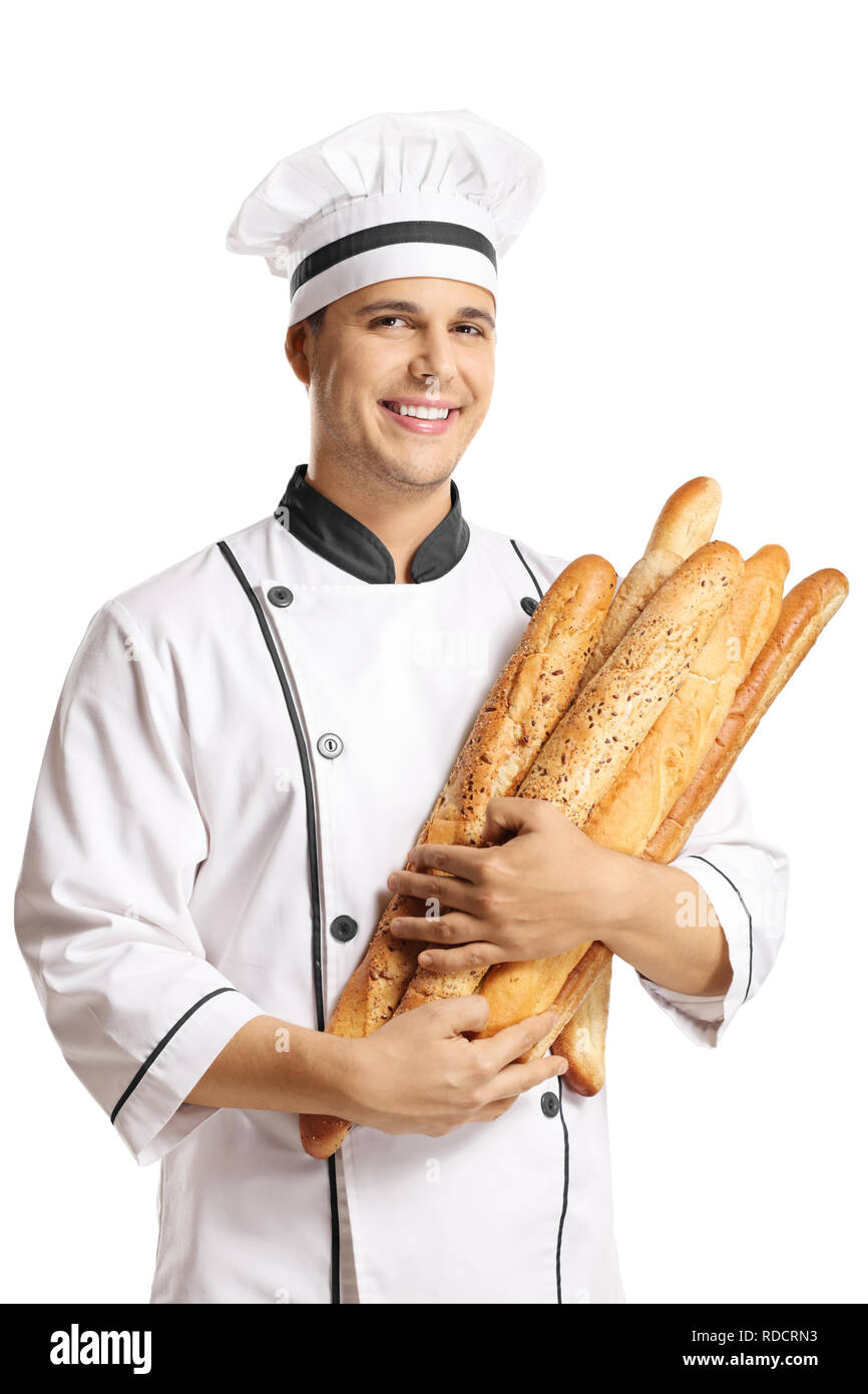 Young male baker holding baguette breads isolated on white background ...