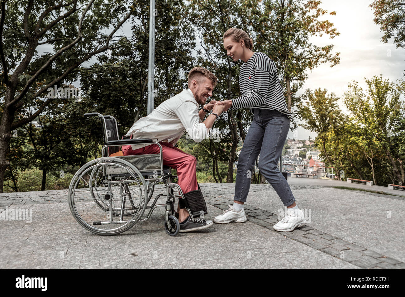 Amazing female person helping her best friend Stock Photo - Alamy