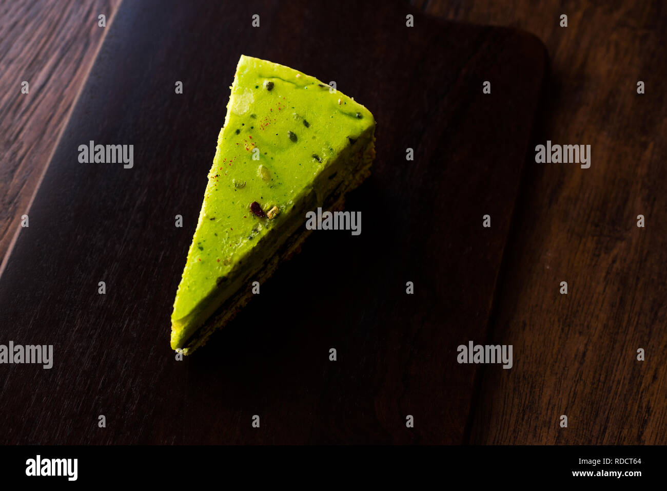 Matcha Green Tea Layer Cake Slice on Dark Wooden Board. Organic Dessert ...