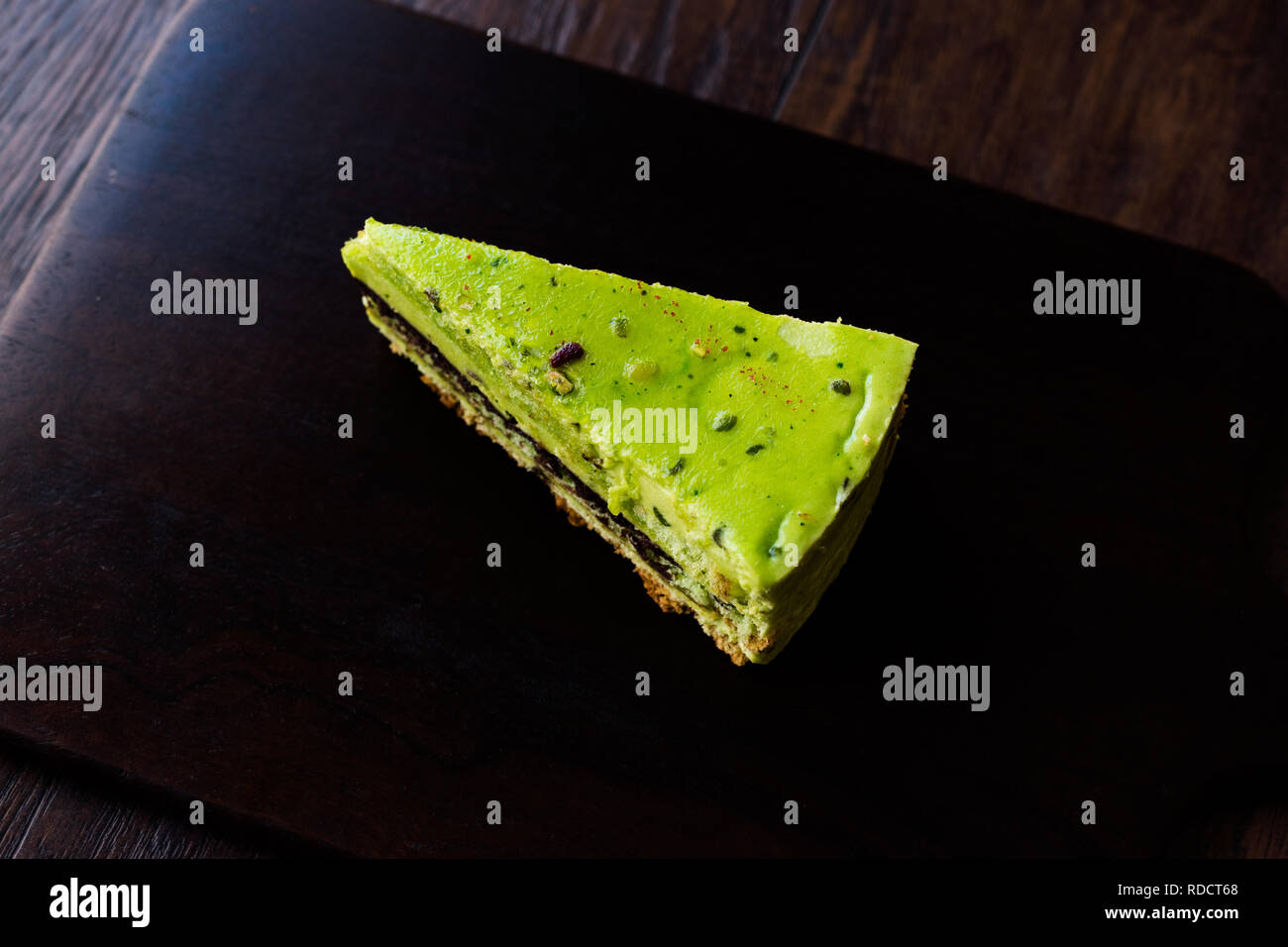 Matcha Green Tea Layer Cake Slice on Dark Wooden Board. Organic Dessert ...