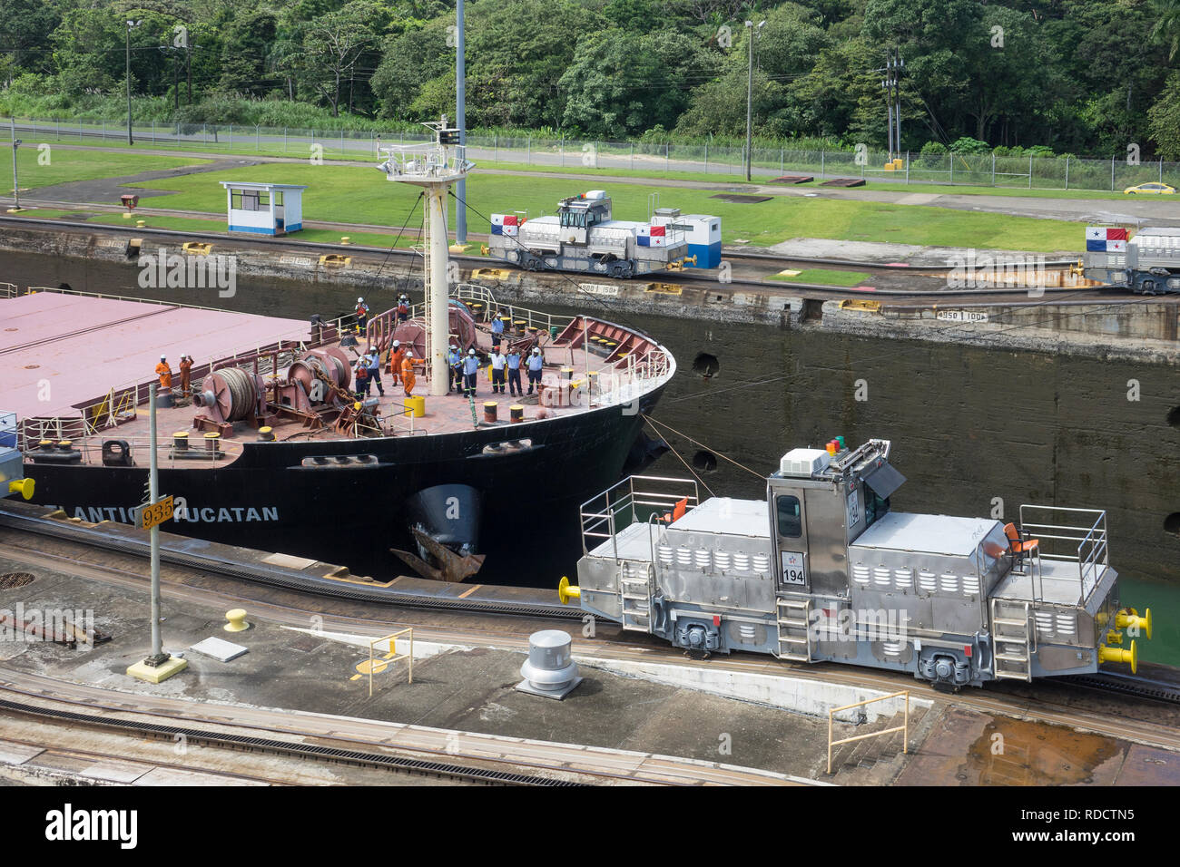 Panama, Panama canal, mule guiding a ship through Gatun lock Stock ...
