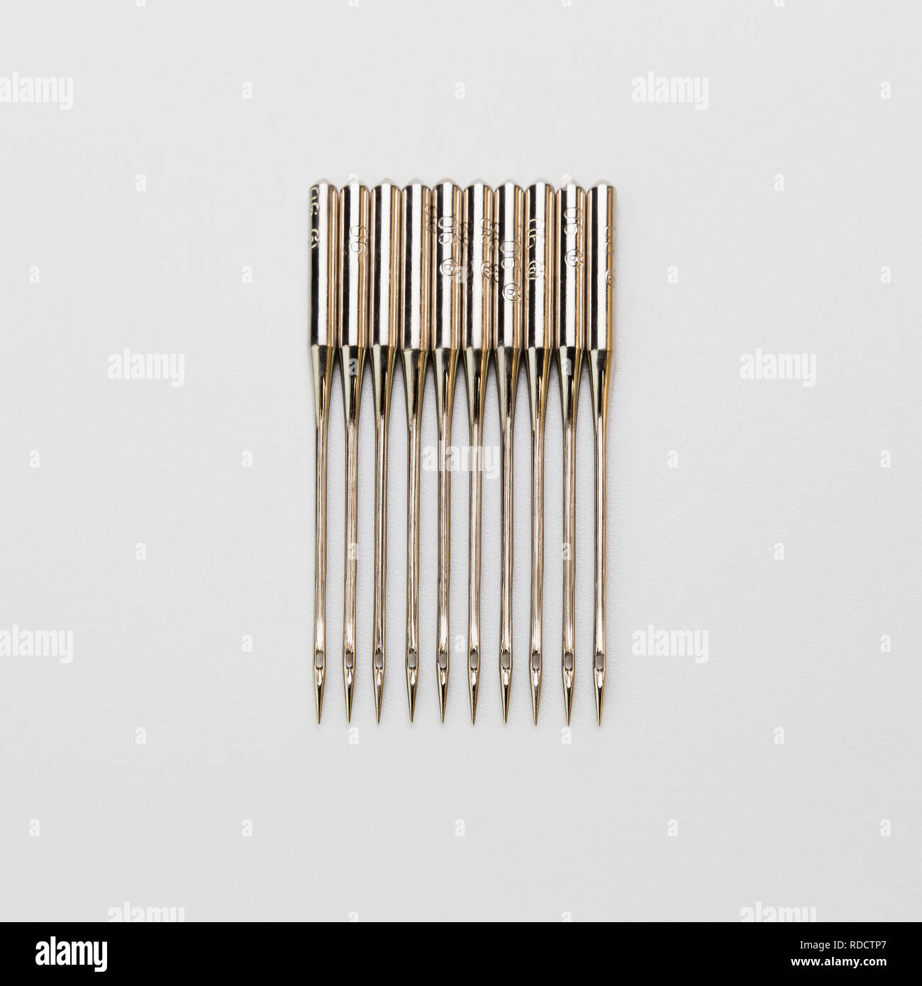 ten sewing needles close-up on a white background isolated Stock Photo ...