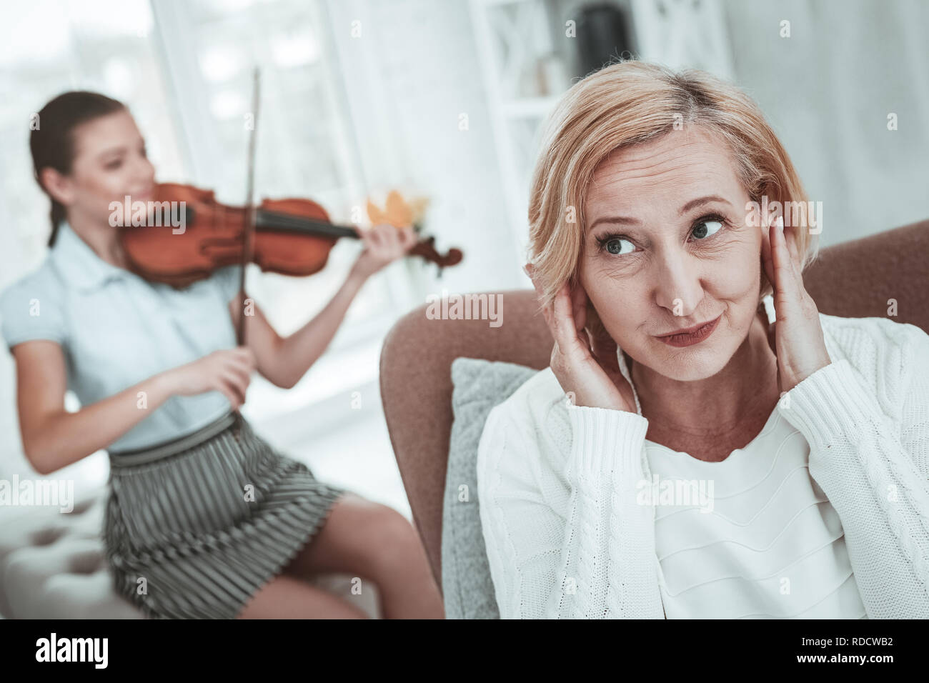 Portrait of a cheerless aged blonde woman Stock Photo - Alamy