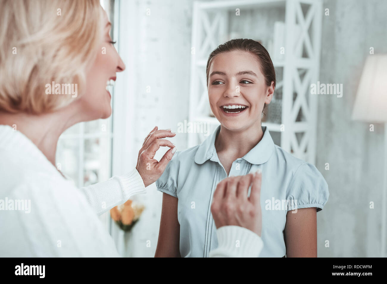 Happy delighted girl wanting to become a singer Stock Photo - Alamy