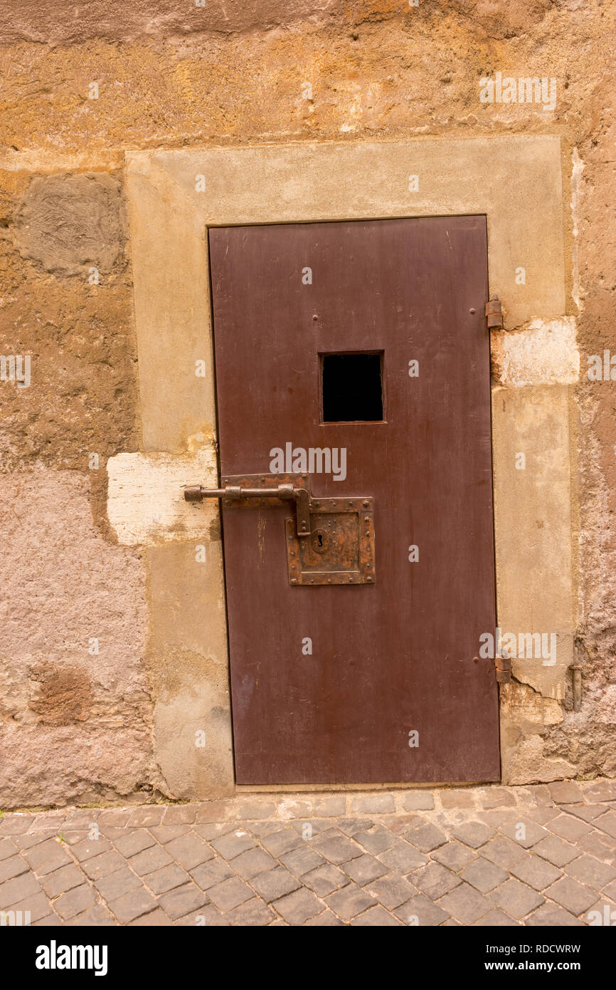 Door with a square hole and latch Stock Photo - Alamy