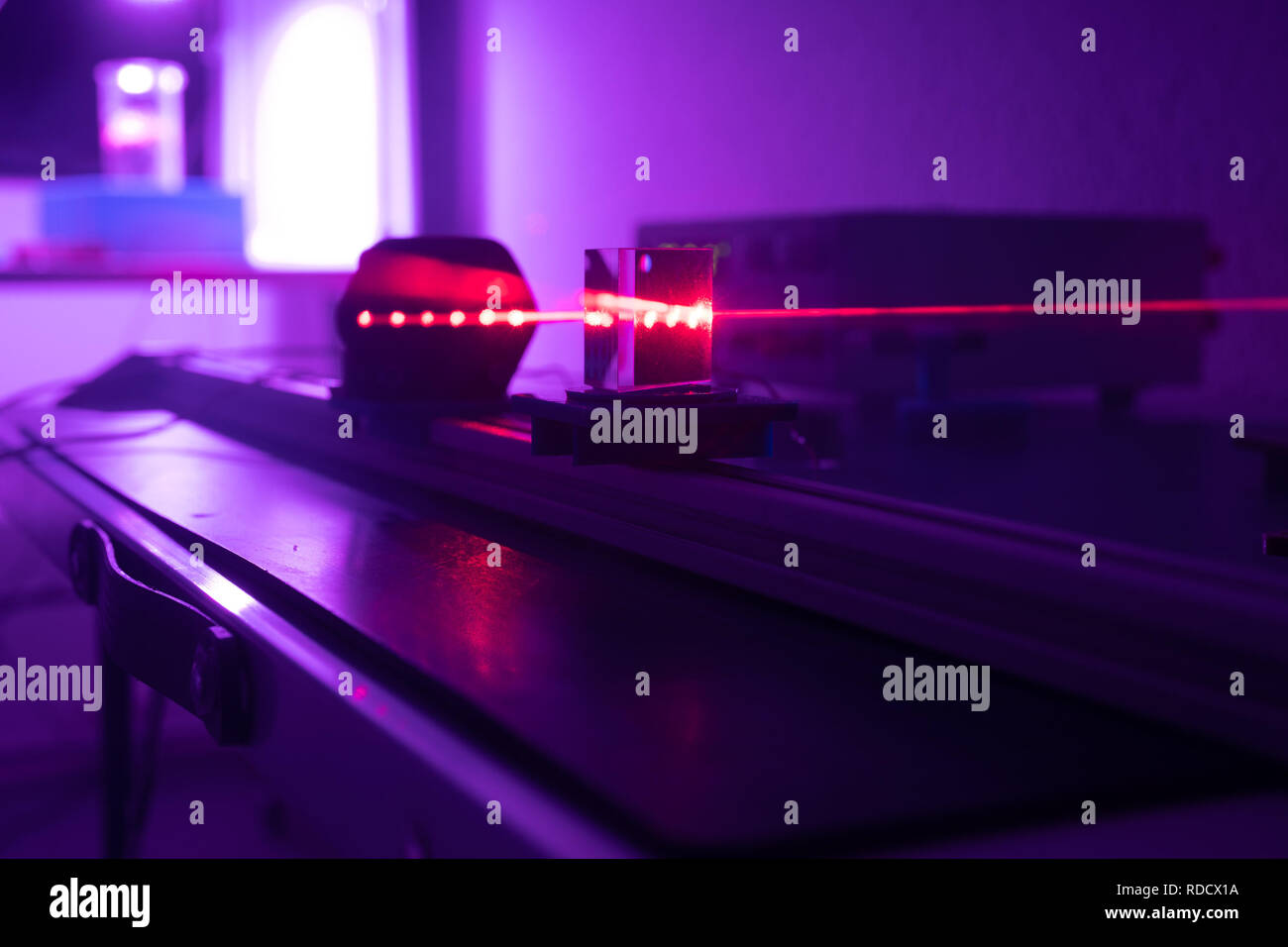 Experiment with red laser in optics lab Stock Photo - Alamy