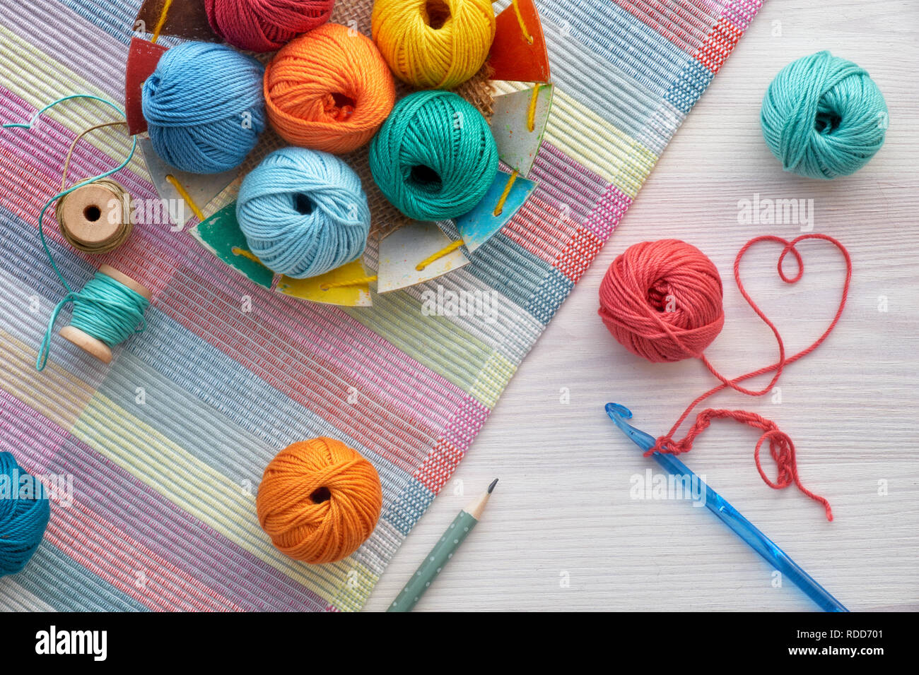 Crochet and yarn balls, top view on light wooden background Stock Photo ...