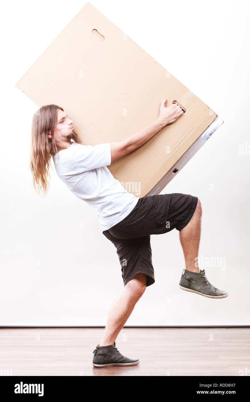 Removal service and delivery concept. Young male guy postal courier ...