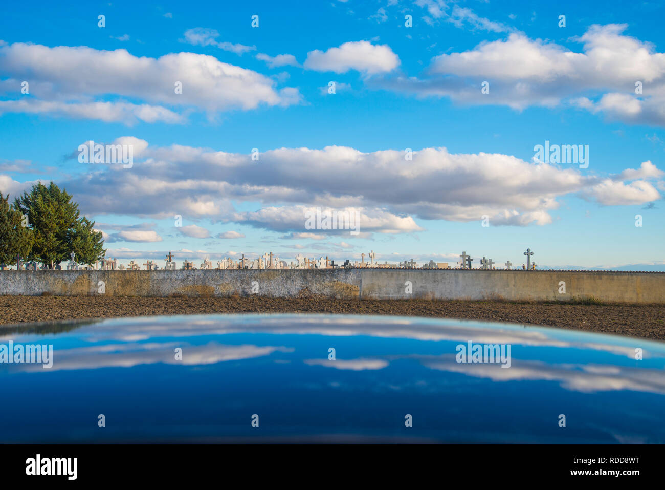 Graveyard and its reflection on shiny surface Stock Photo - Alamy