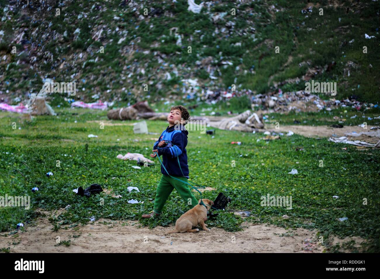 Gaza, Palestine. 17th Jan, 2019. A child playing with his dog in the ...
