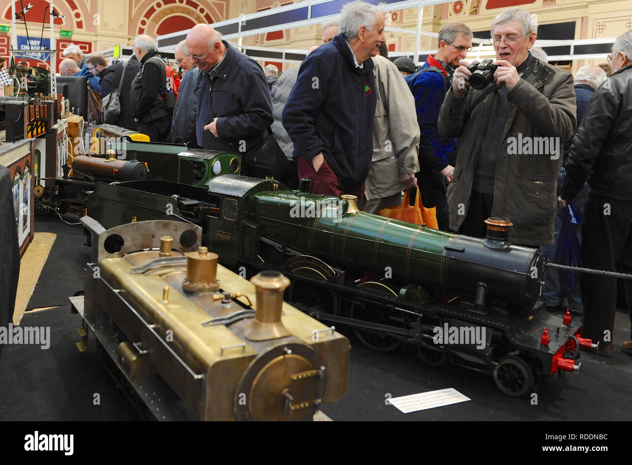 London, UK. 18th Jan 2019. Visitors looking at large scale models of ...