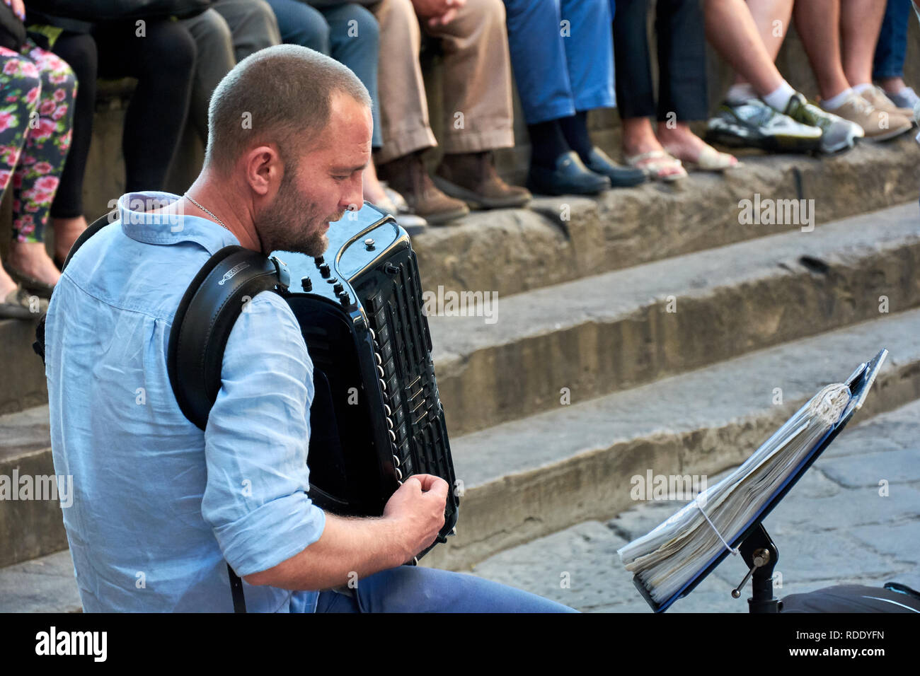 Street musicians giving a spectacular show in Piazza della Signoria in ...
