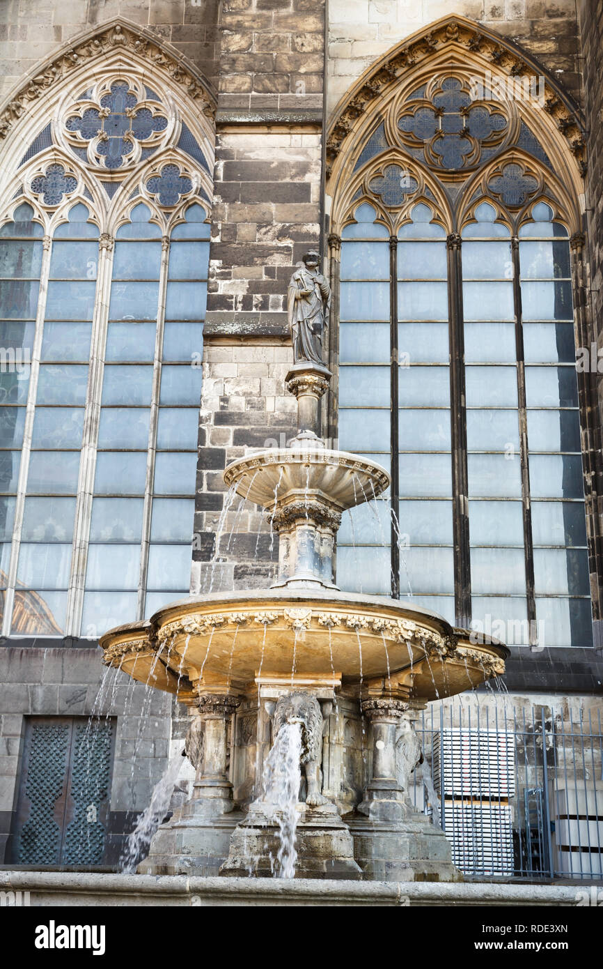 Petrus fountain at the south side of Cologne Cathedral, Germany Stock ...