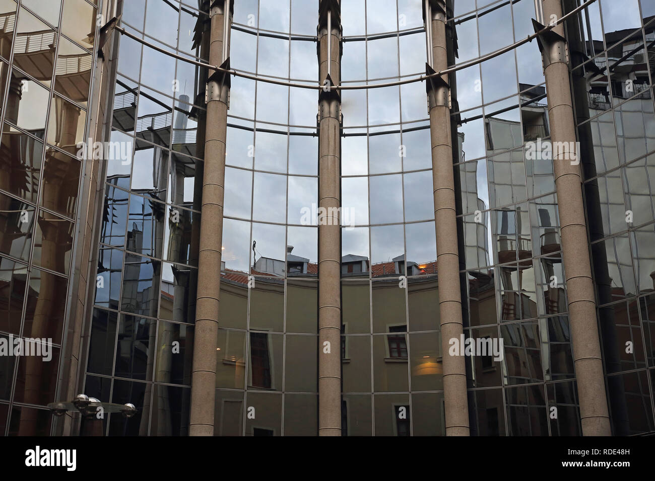 Modern Office Building With Glass Reflections and Columns Stock Photo ...
