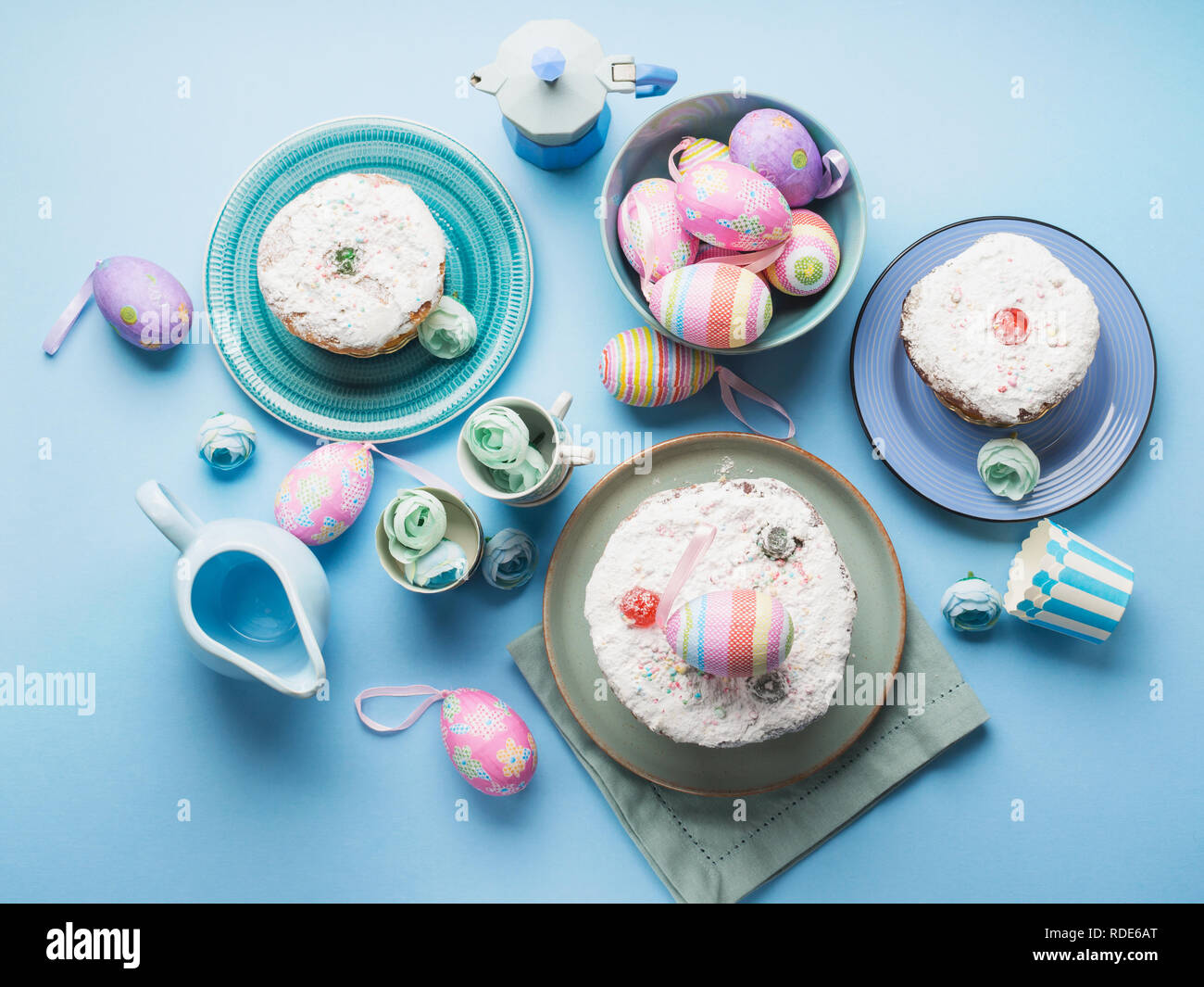 Easter concept background with cake and decor eggs on minimal blue ...