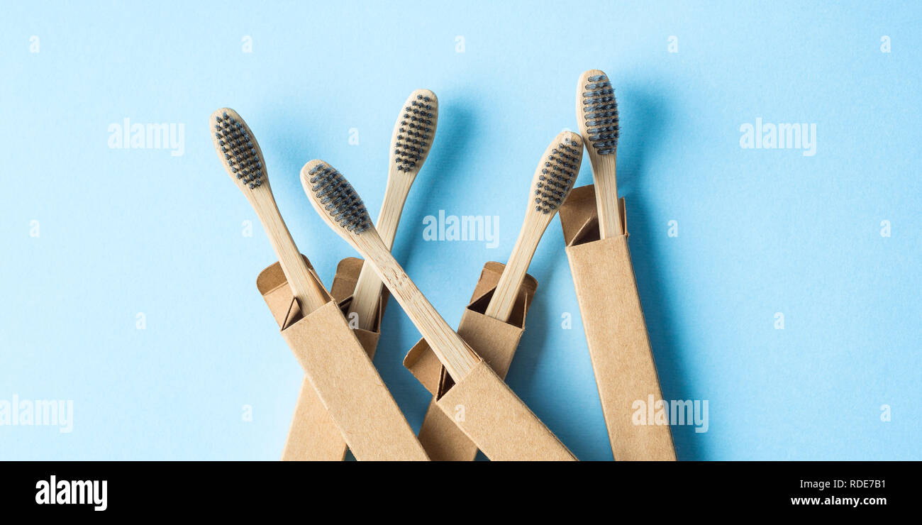 Bamboo biodegradable toothbrushes on blue with eco friendly cardboard ...