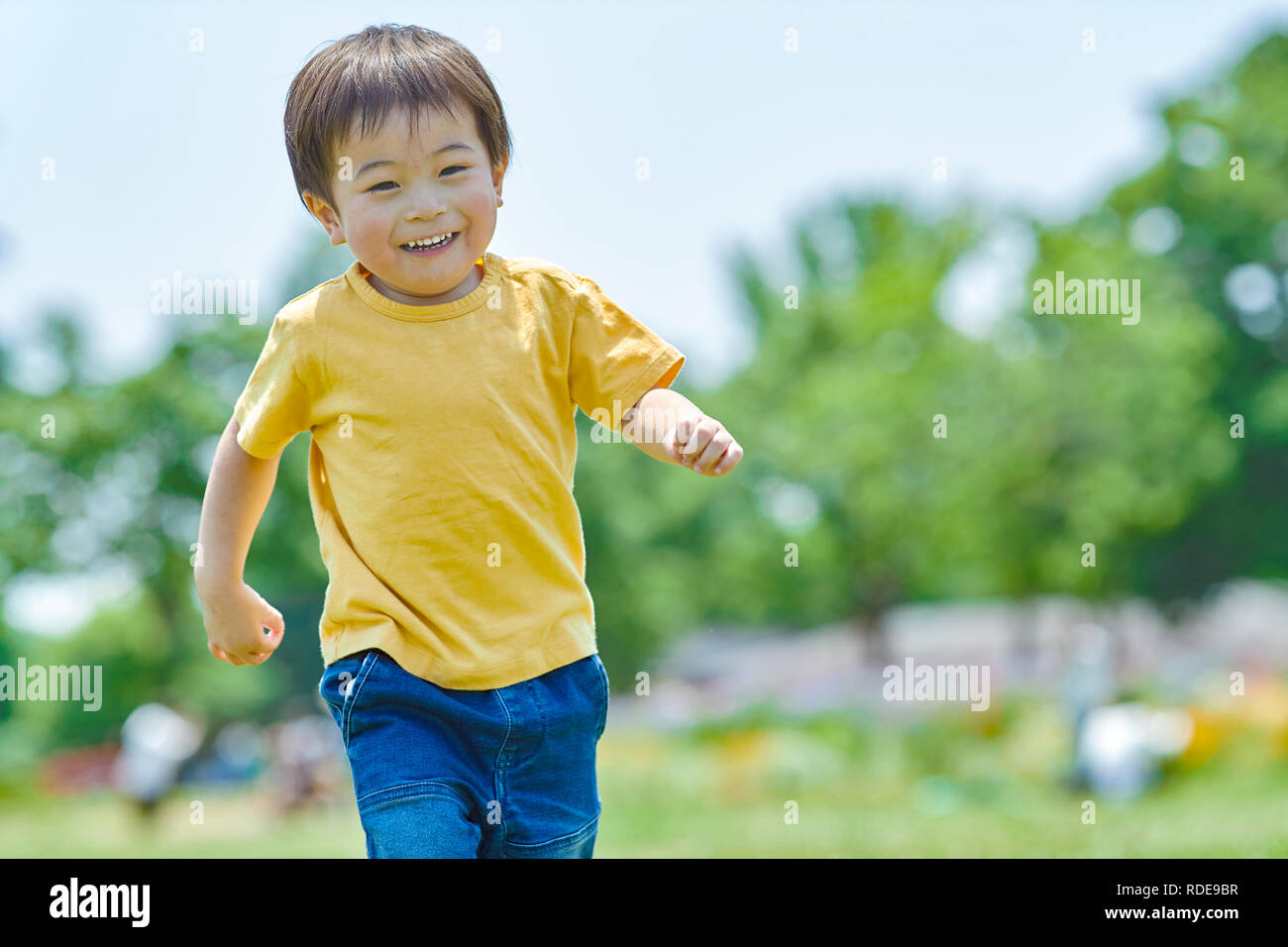 Japanese kid in a city park Stock Photo - Alamy