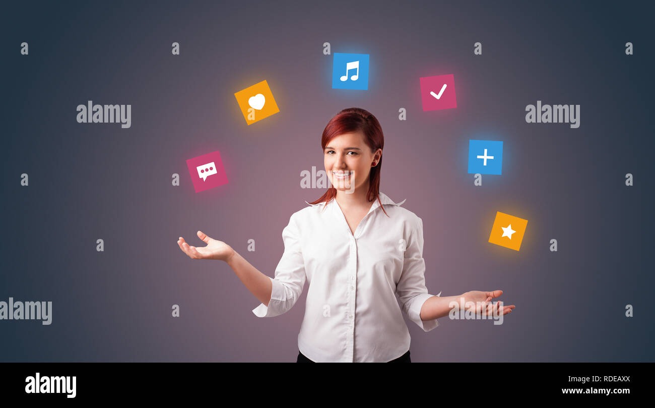 Young person juggle with application icons Stock Photo - Alamy
