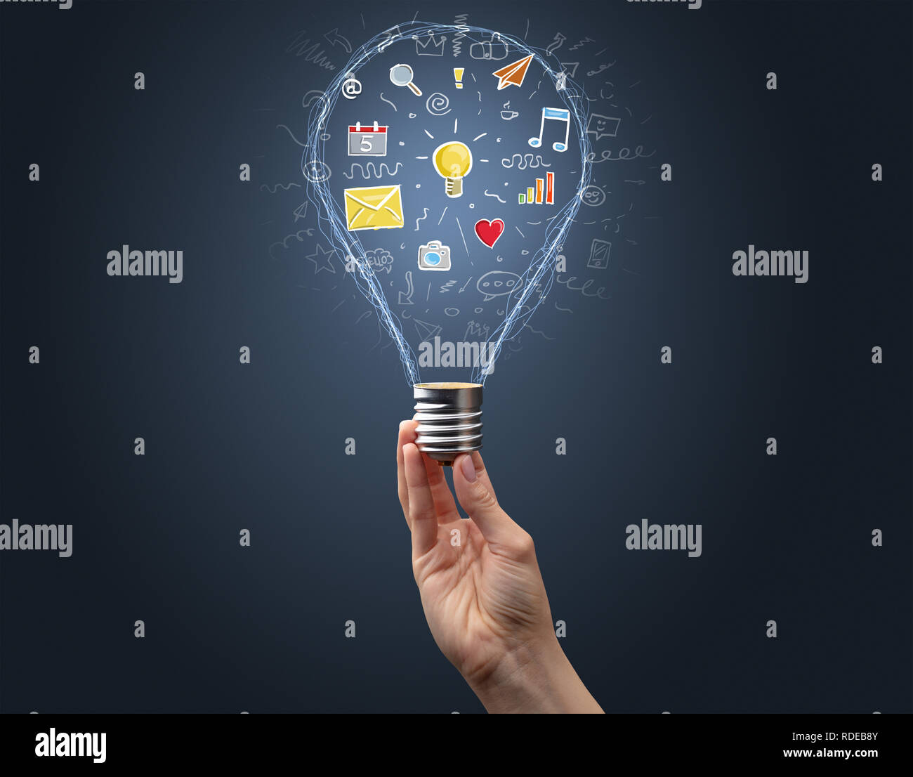 Hand holding light bulb on dark background. New apps concept Stock Photo - Alamy