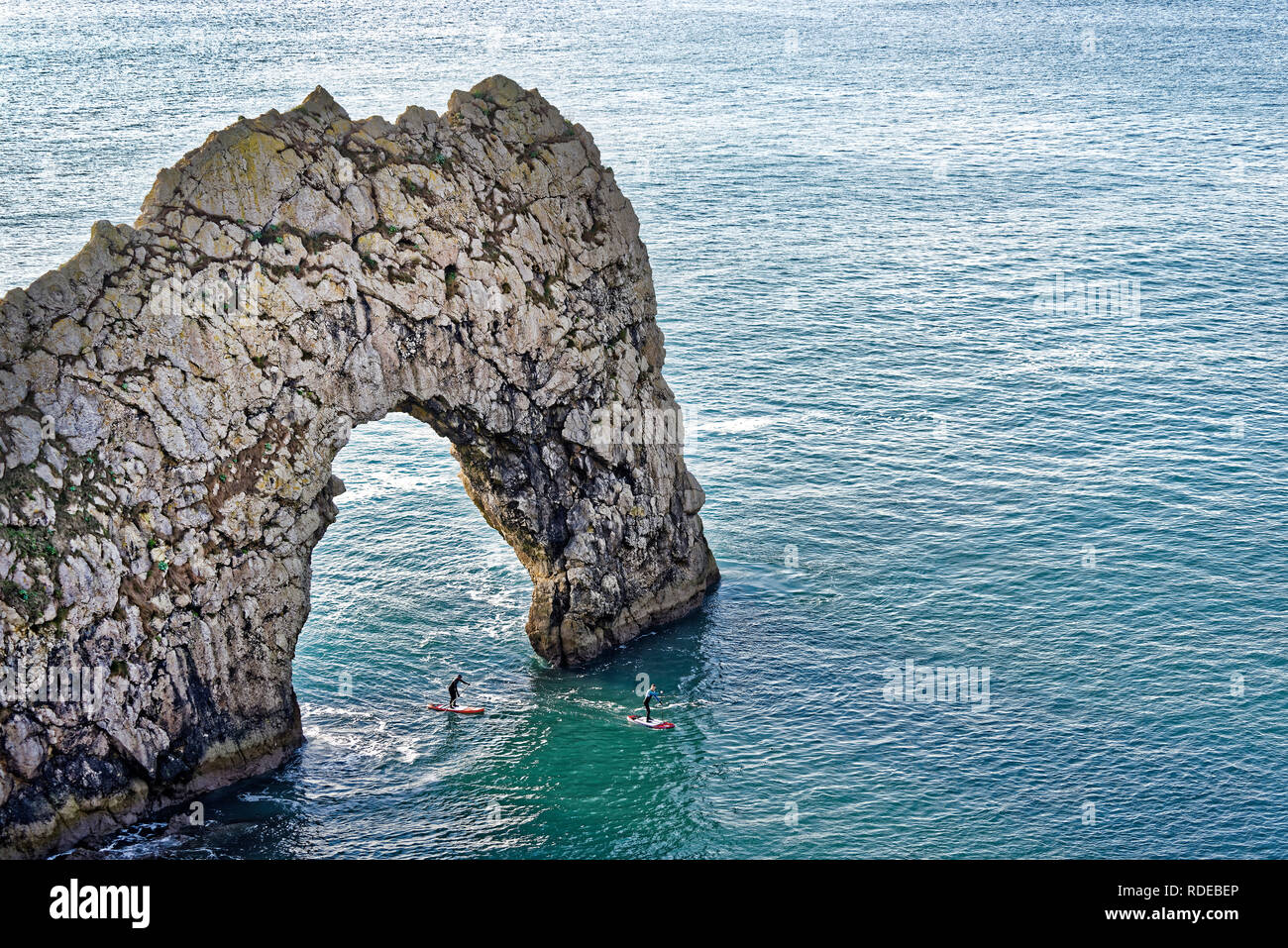Durdle Door is a natural limestone arch on the Jurassic Coast near ...