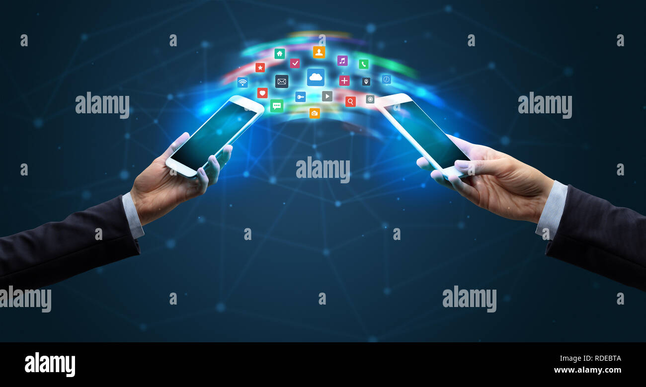 Two mobile phones syncing applications concept Stock Photo - Alamy