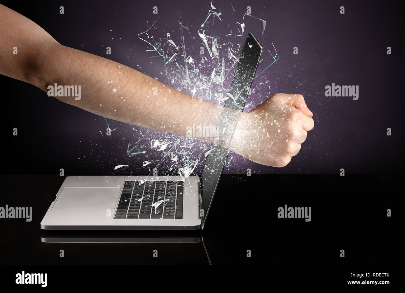 Hand hitting strongly laptop screen glass Stock Photo - Alamy