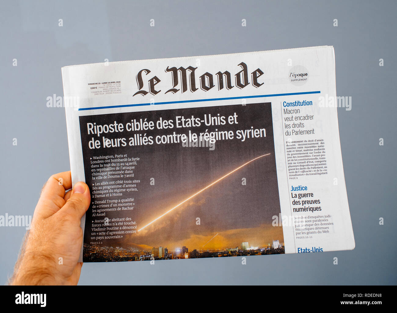 PARIS, FRANCE - APR 15, 2014: Le Monde French newspaper in man hand ...