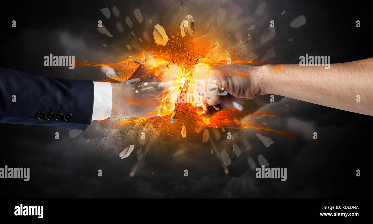 Two hands fighting and breaking a rock into small pieces Stock Photo ...